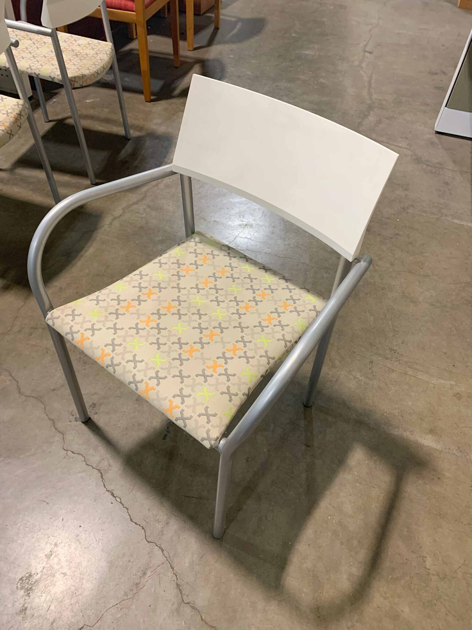 JSI Cym Arm Stack Chair | Capital Furniture